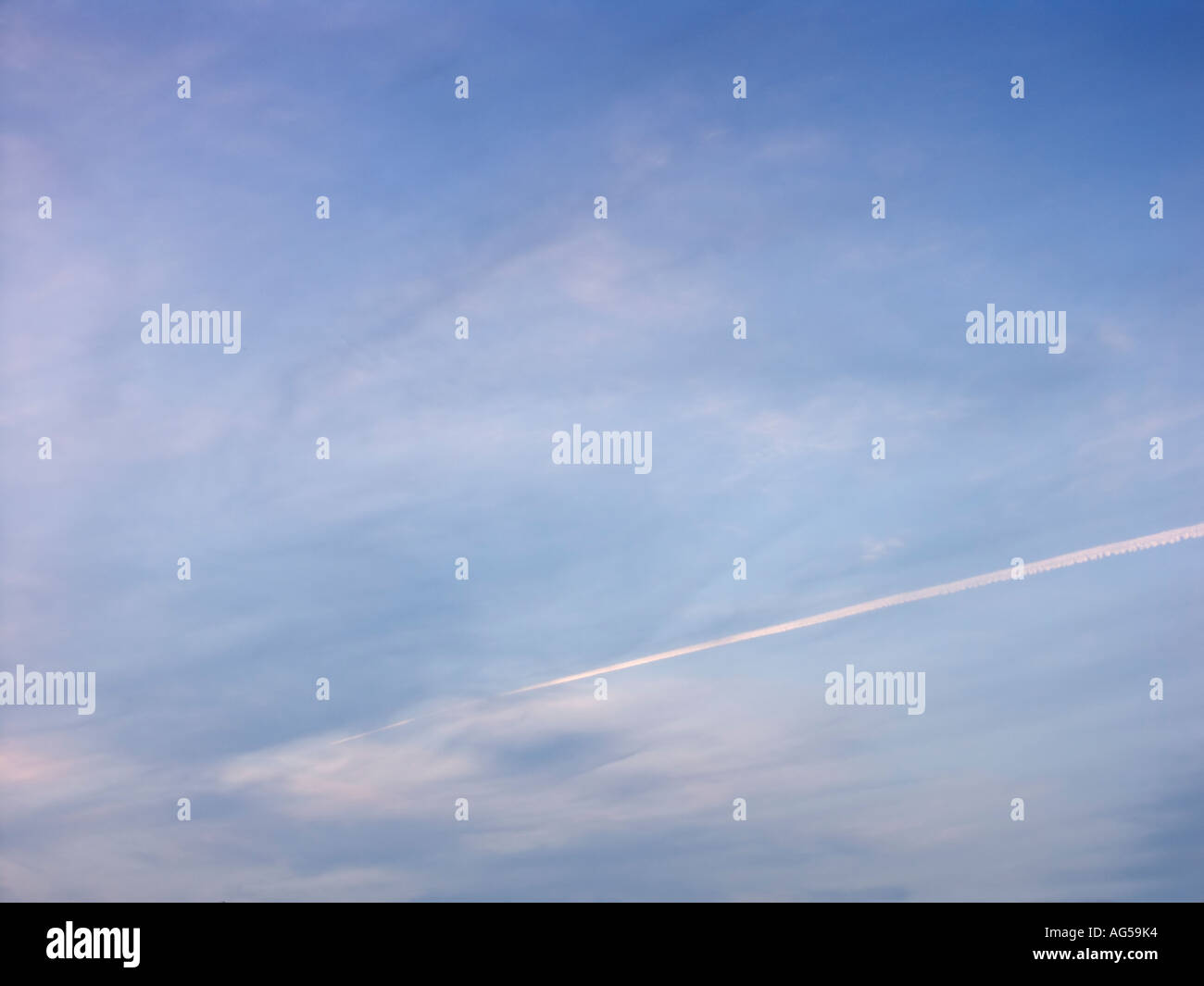 Summer blue sky with vapour trail or contrail Stock Photo - Alamy