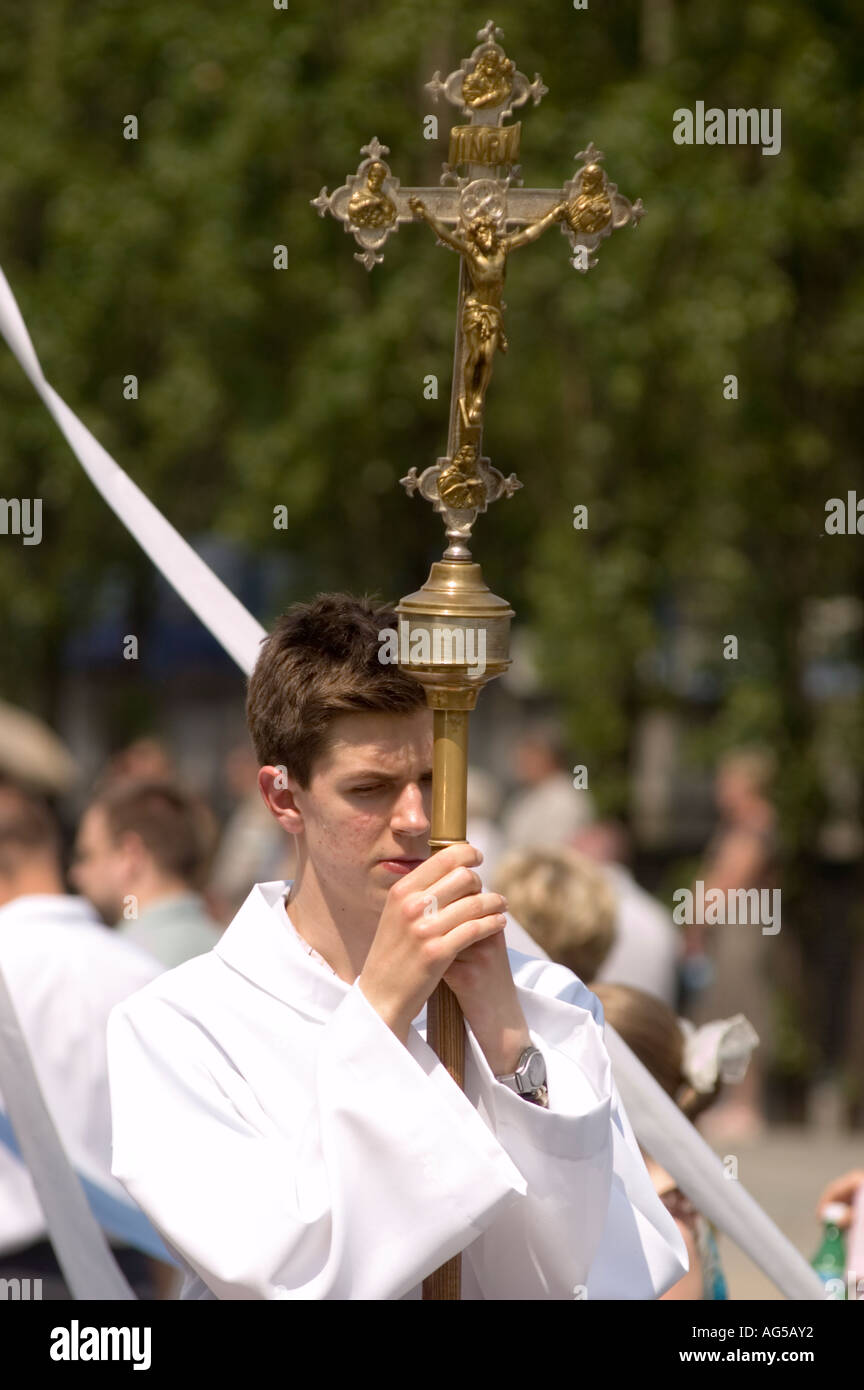 Polish Roman Catholic priest carrying cross during Corpus Christi Day ...