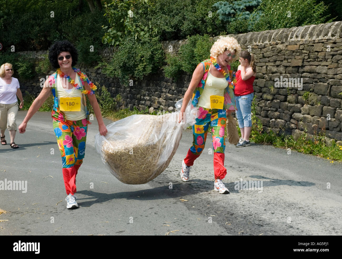 Runners dressed as hippies for the 2006 Oxenhope Straw Race Stock Photo ...