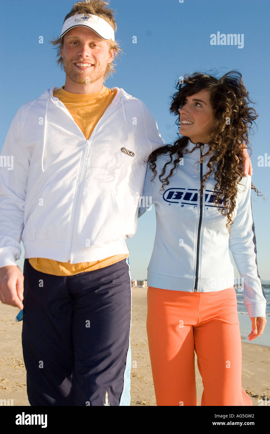 modern couple walking together smiling Stock Photo - Alamy