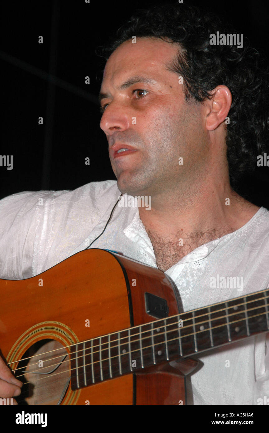 Ori Cohen from Esev Bar (Wild Grass) on stage with his guitar Jacob's ...