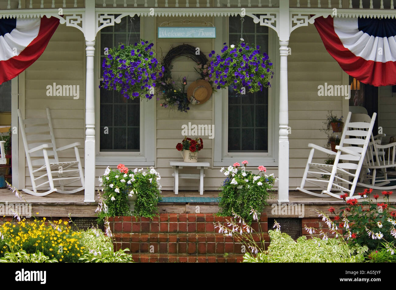 Patriotic Bunting on Porch of Victorian Cottage with Beautiful Garden ...