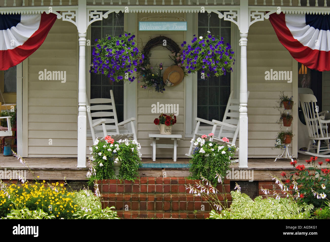 Patriotic Bunting on Porch of Victorian Cottage with Beautiful Garden ...
