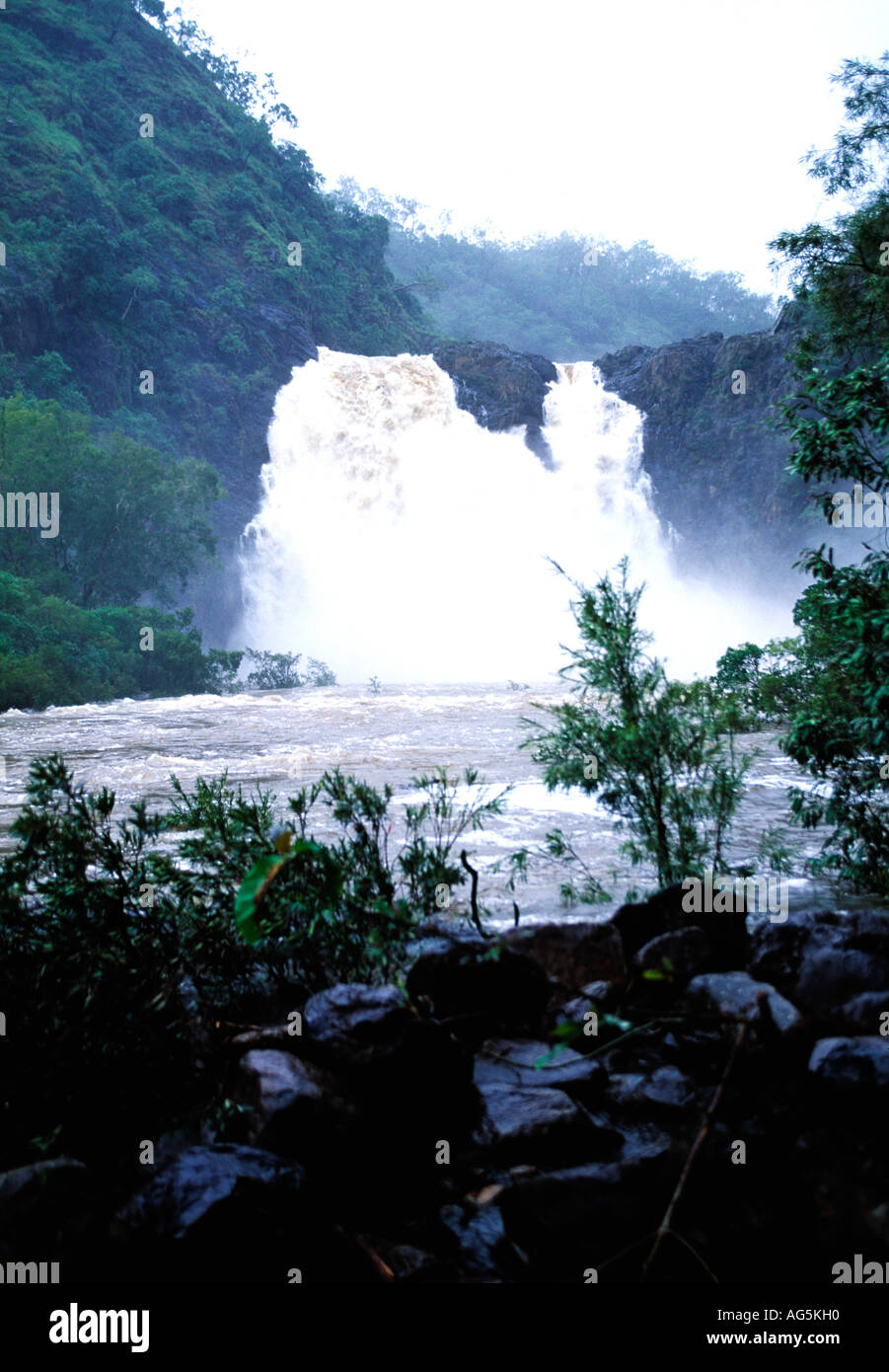 large waterfall rolling over cliff edge Stock Photo - Alamy