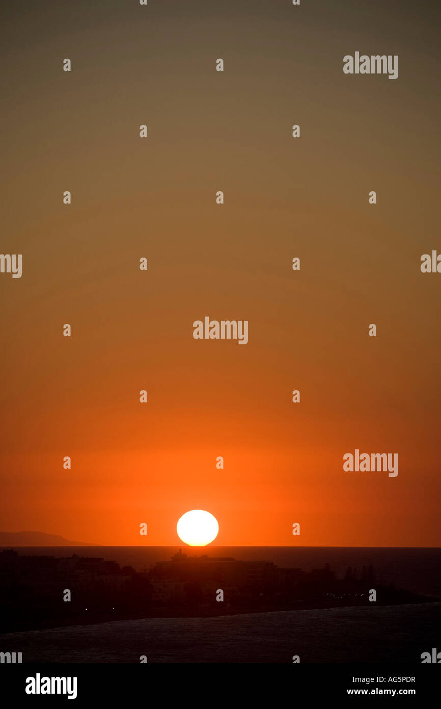 The sun setting over Trianta Bay and the town of Ixia on the Greek ...