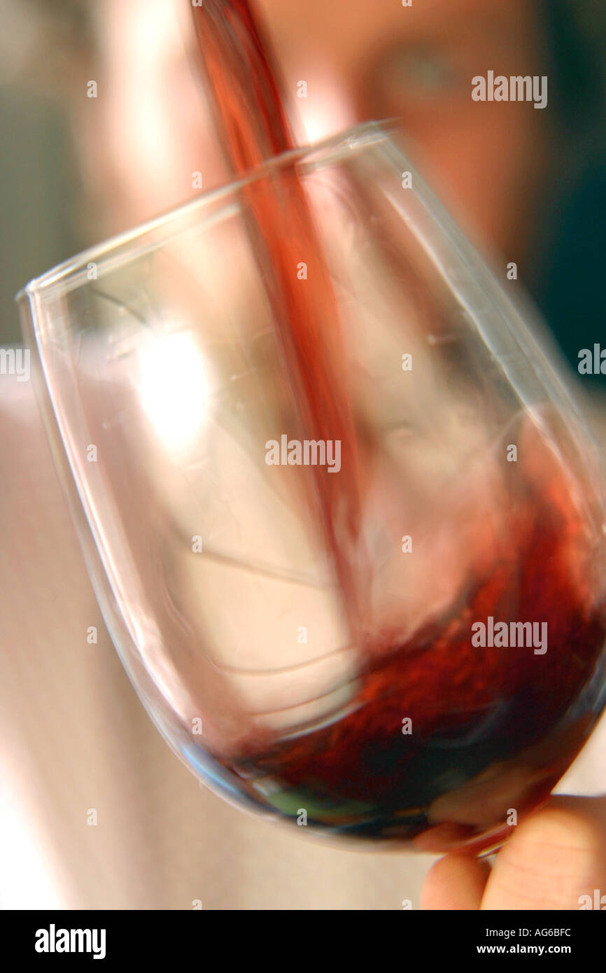 pouring red wine Stock Photo - Alamy