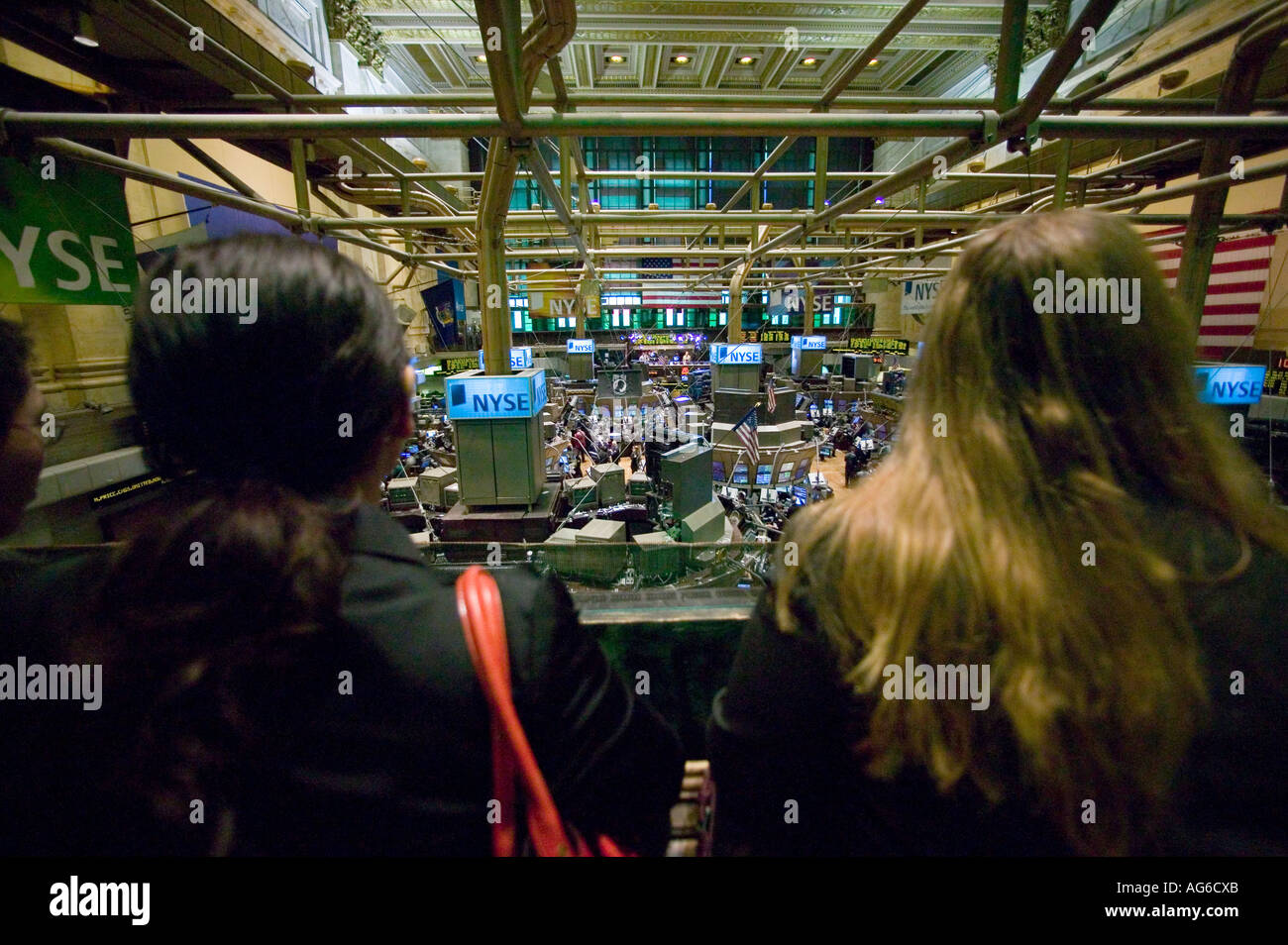 Visitors look out at the main trading room from the members viewing ...