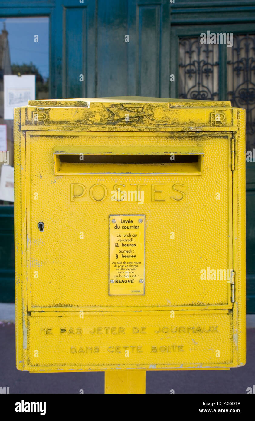 Yellow post box in a Beaune street, France, a quintessential french ...