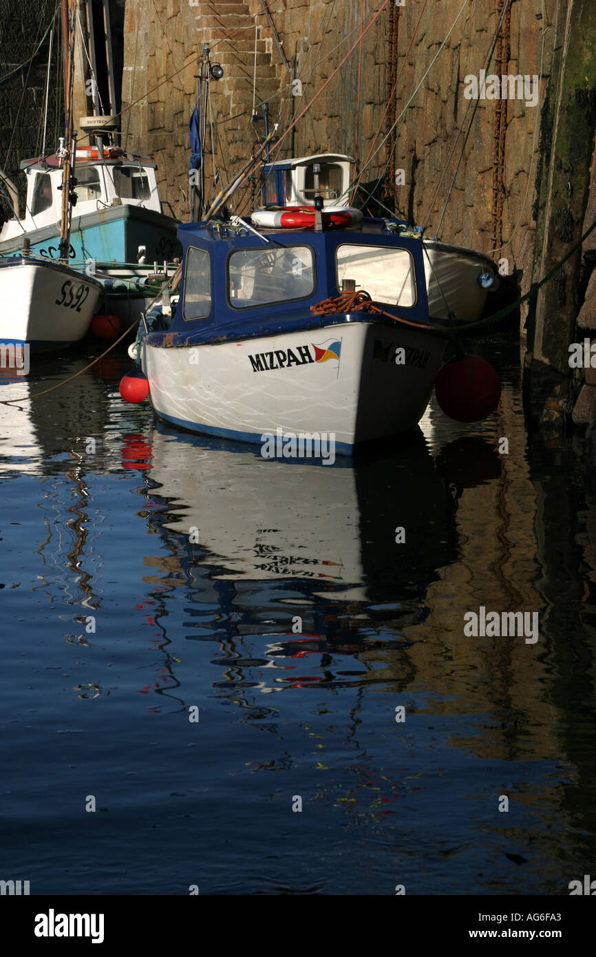 fishing boat and reflection Stock Photo - Alamy