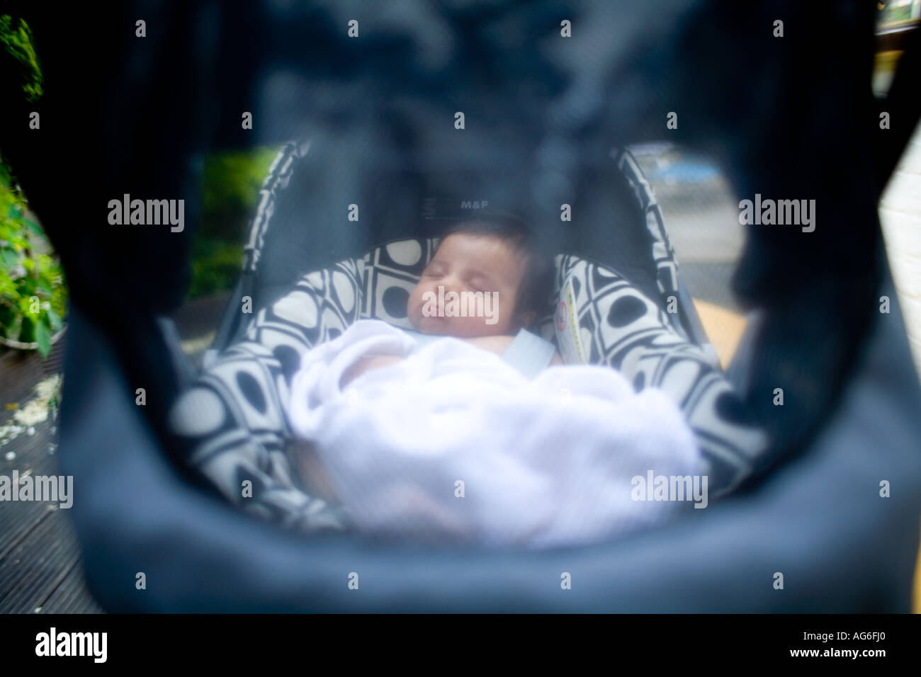 Sleeping baby boy in pram Stock Photo - Alamy