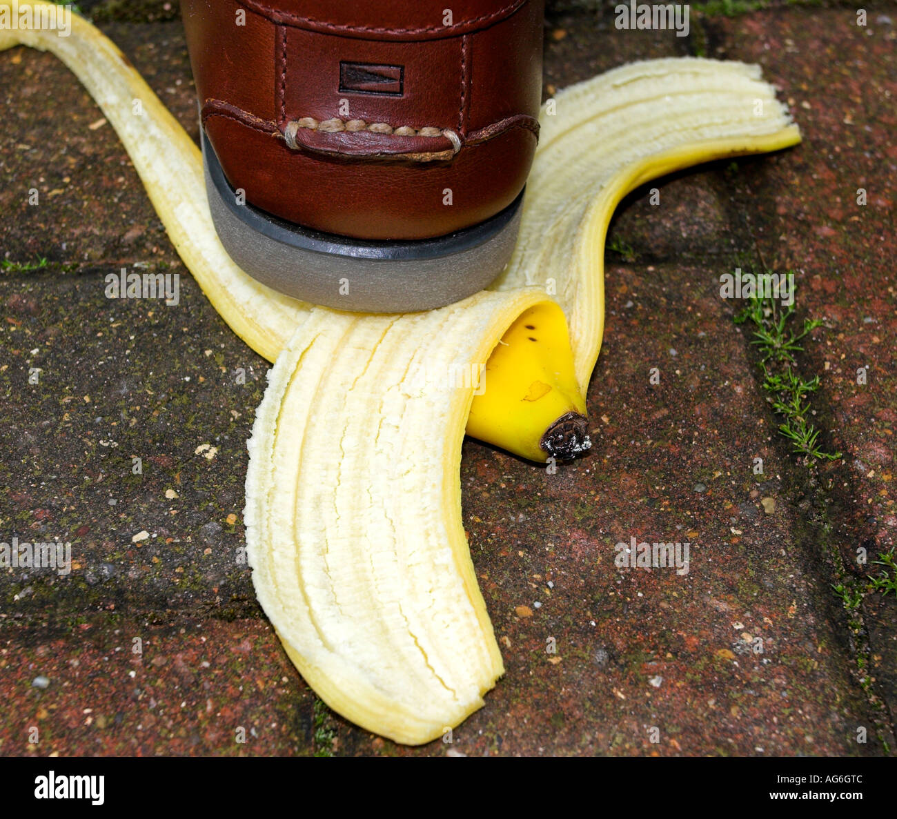 Person about to tread on a banana skin and slip up Stock Photo - Alamy