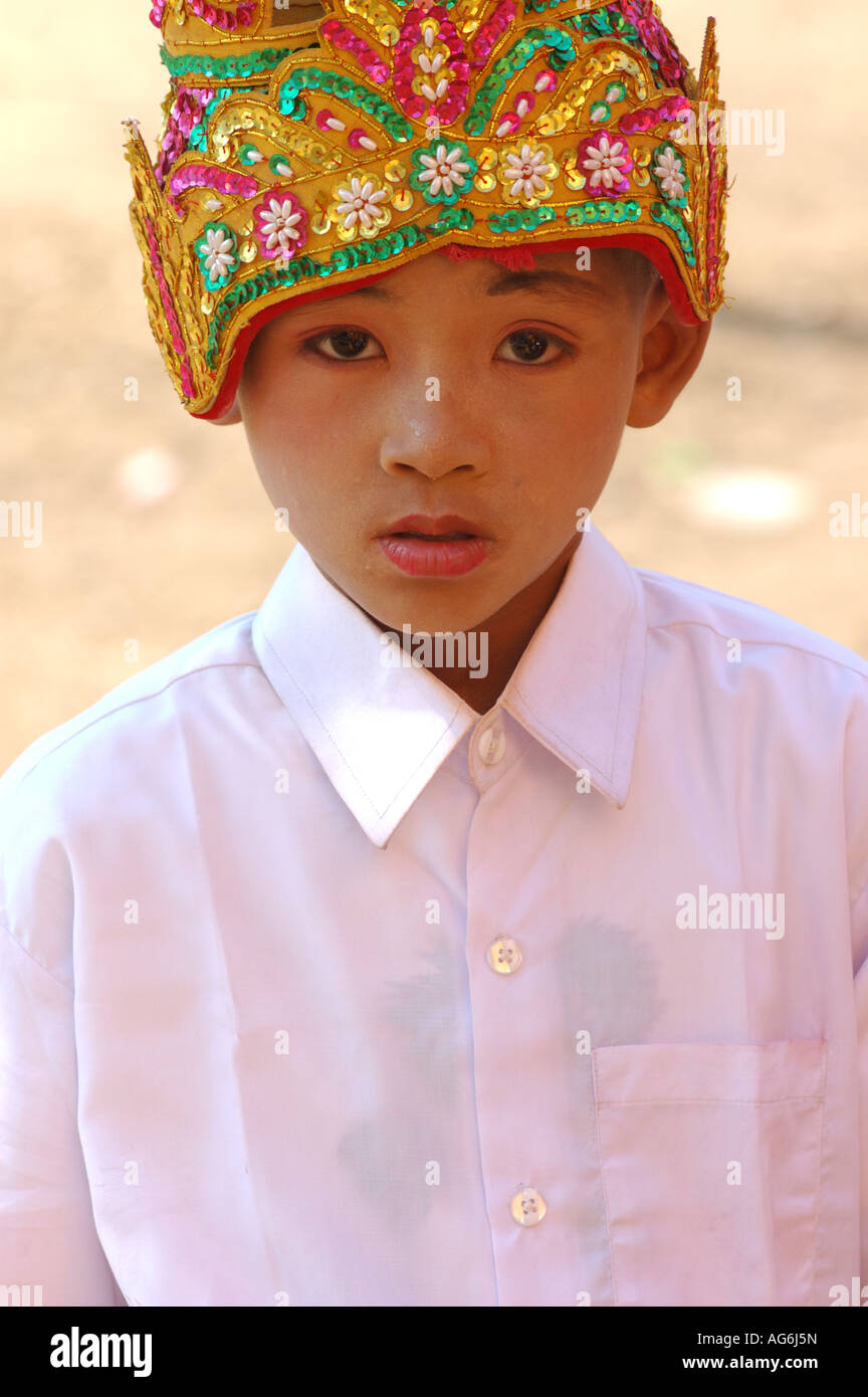 A young boy in traditional coustume takes place in a ceremoy where he ...