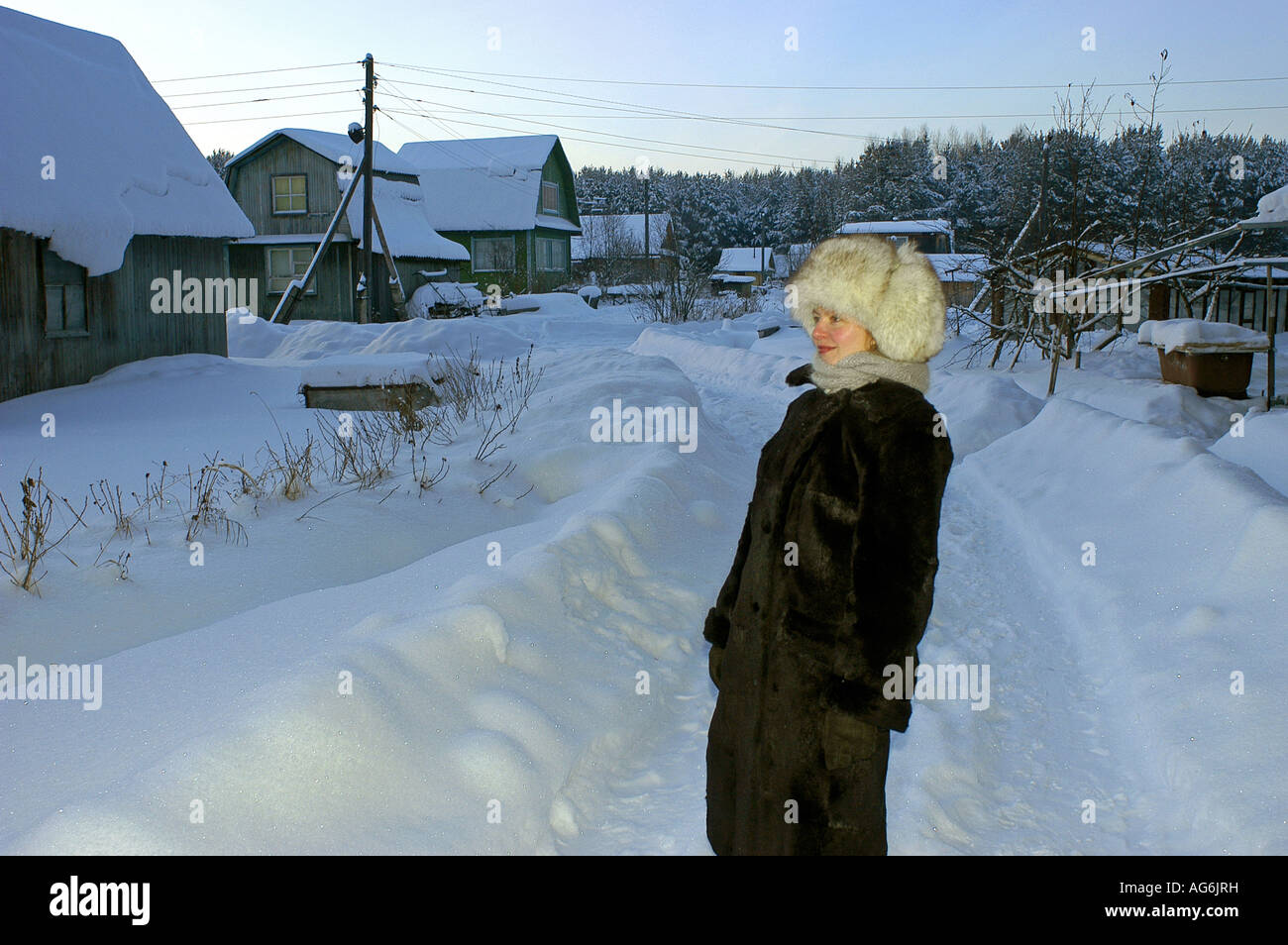 Shot taken in Glazov, Russia of Women looking at snow scene from rural ...