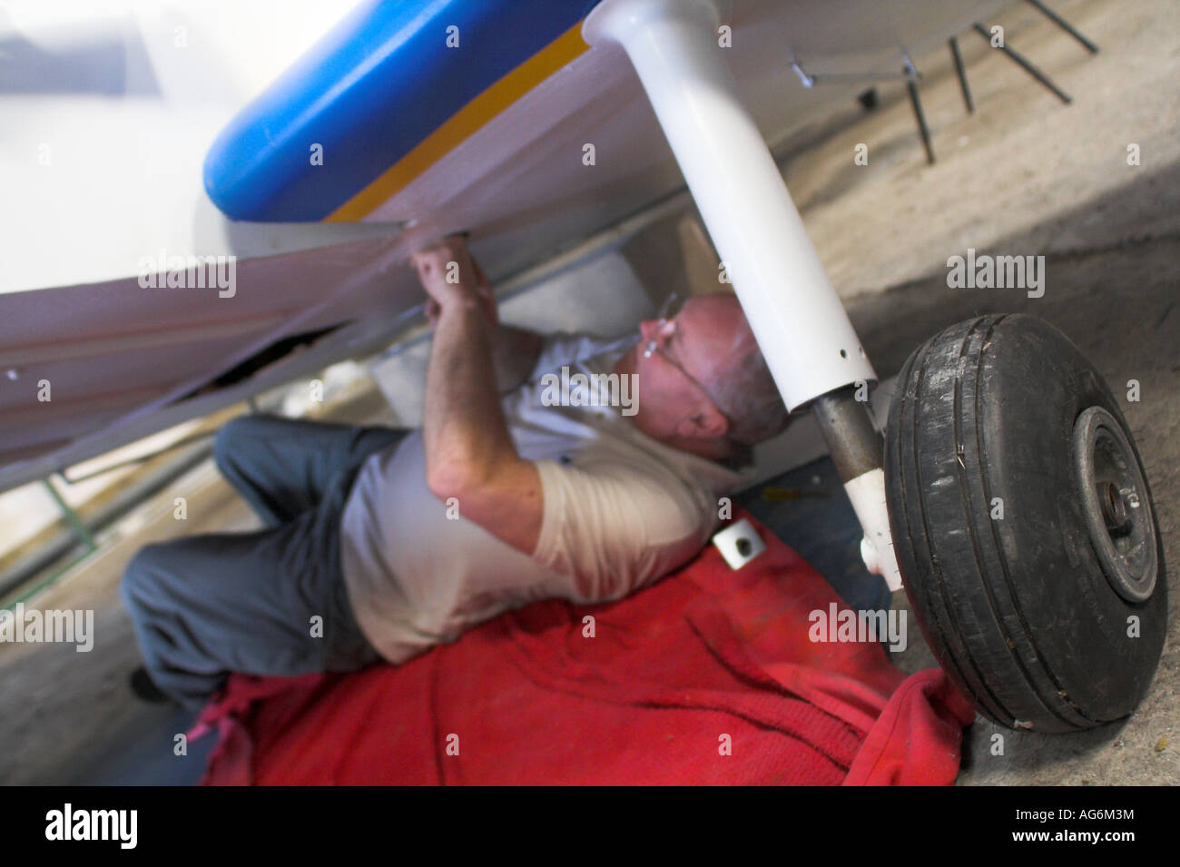 Aircraft maintenance in a hanger Stock Photo - Alamy
