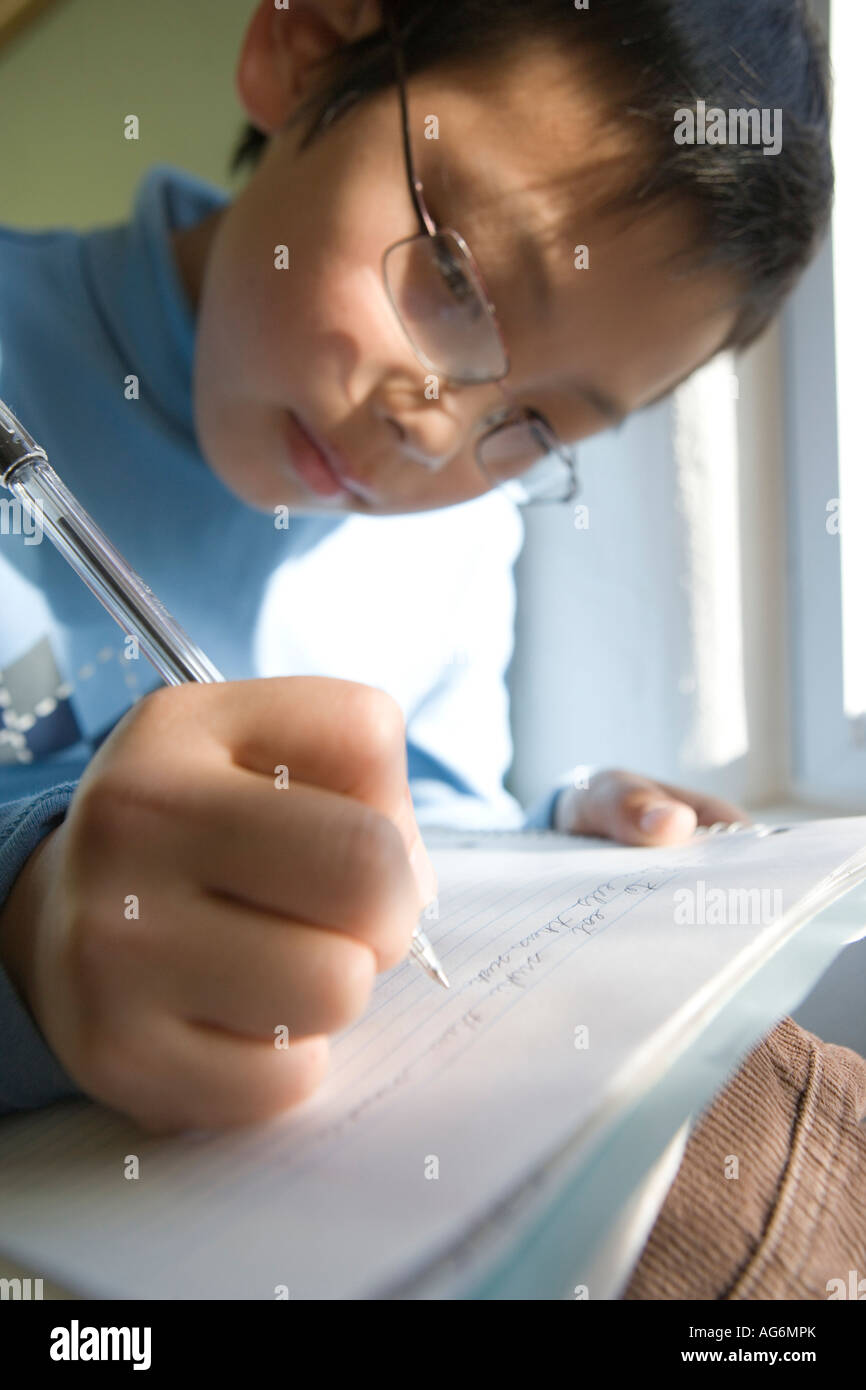 Ten year old child writing hi-res stock photography and images - Alamy