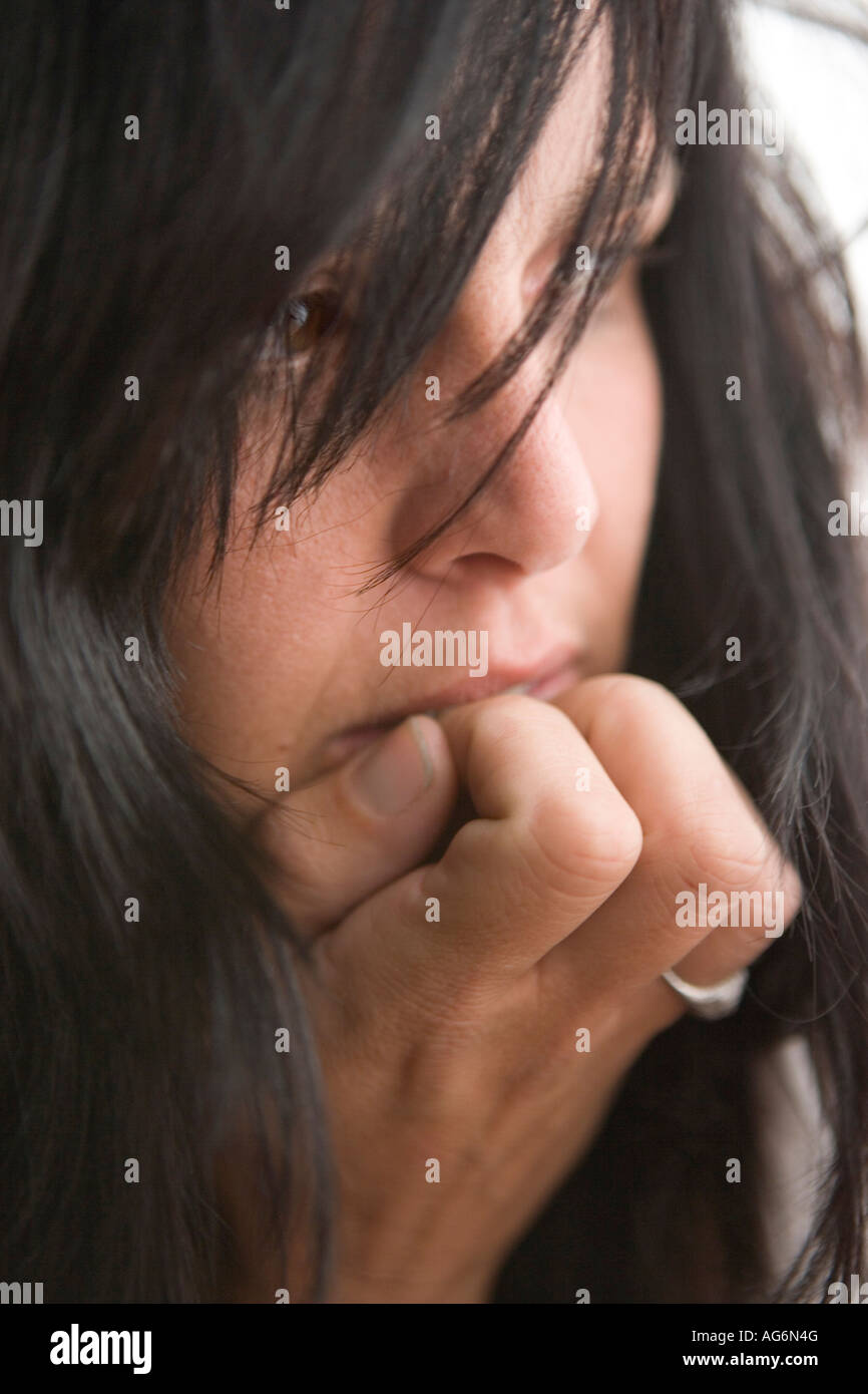 woman biting fingernails, close up Stock Photo - Alamy