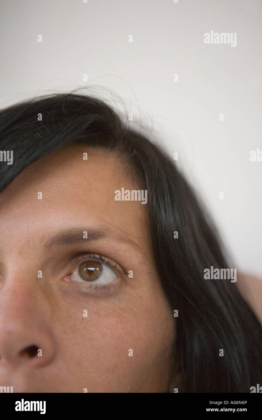 anxious woman face closeup, looking up, wondering Stock Photo - Alamy