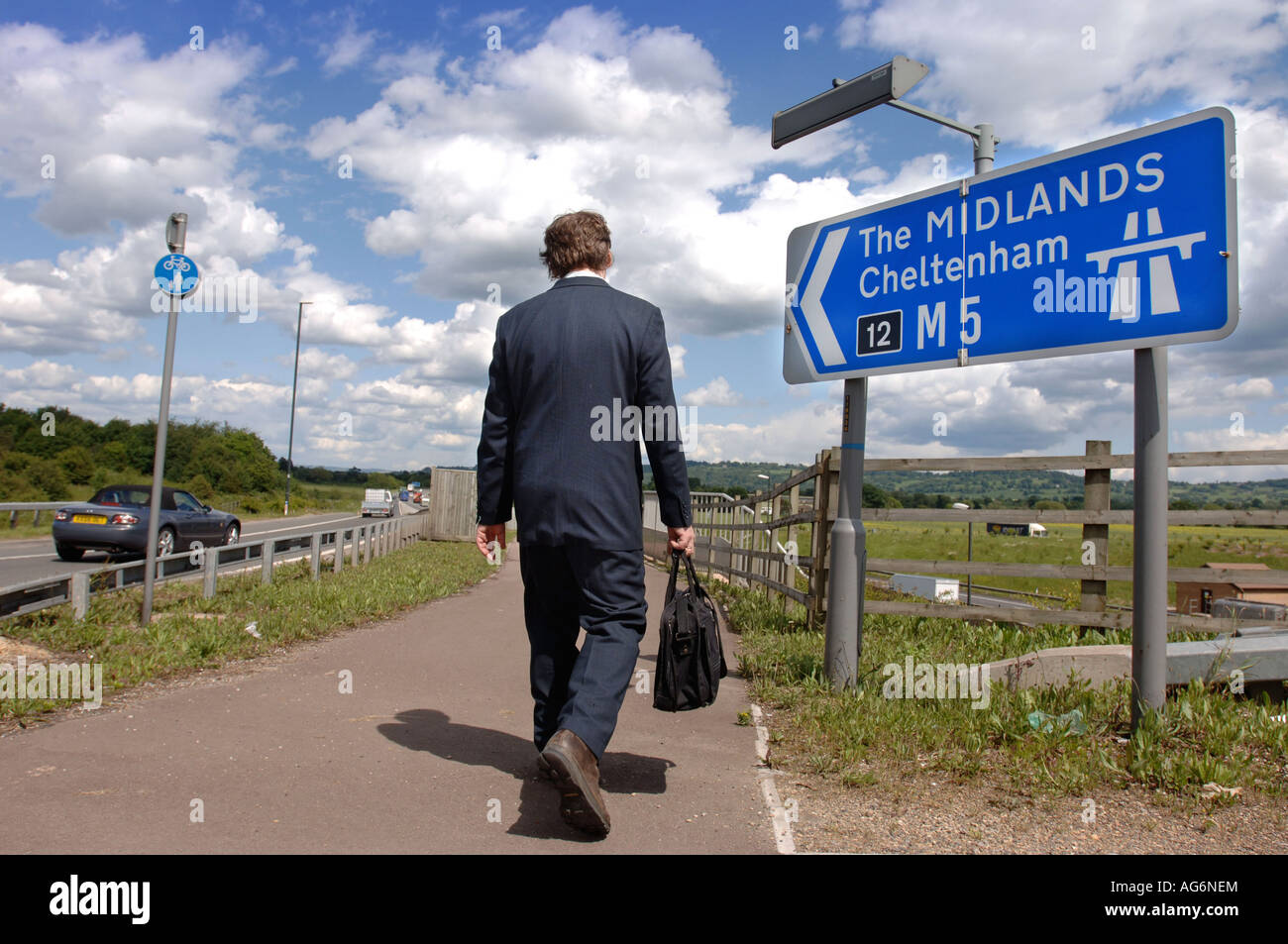 A MAN WALKS TOWARDS A MOTORWAY JUNCTION ON THE M5 UK Stock Photo - Alamy
