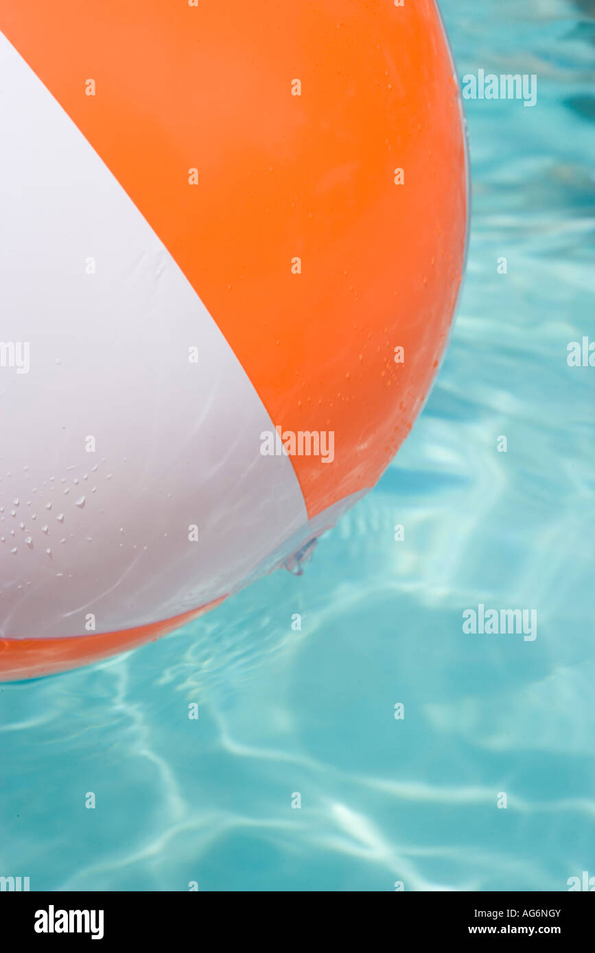 beach ball floating in blue water Stock Photo - Alamy