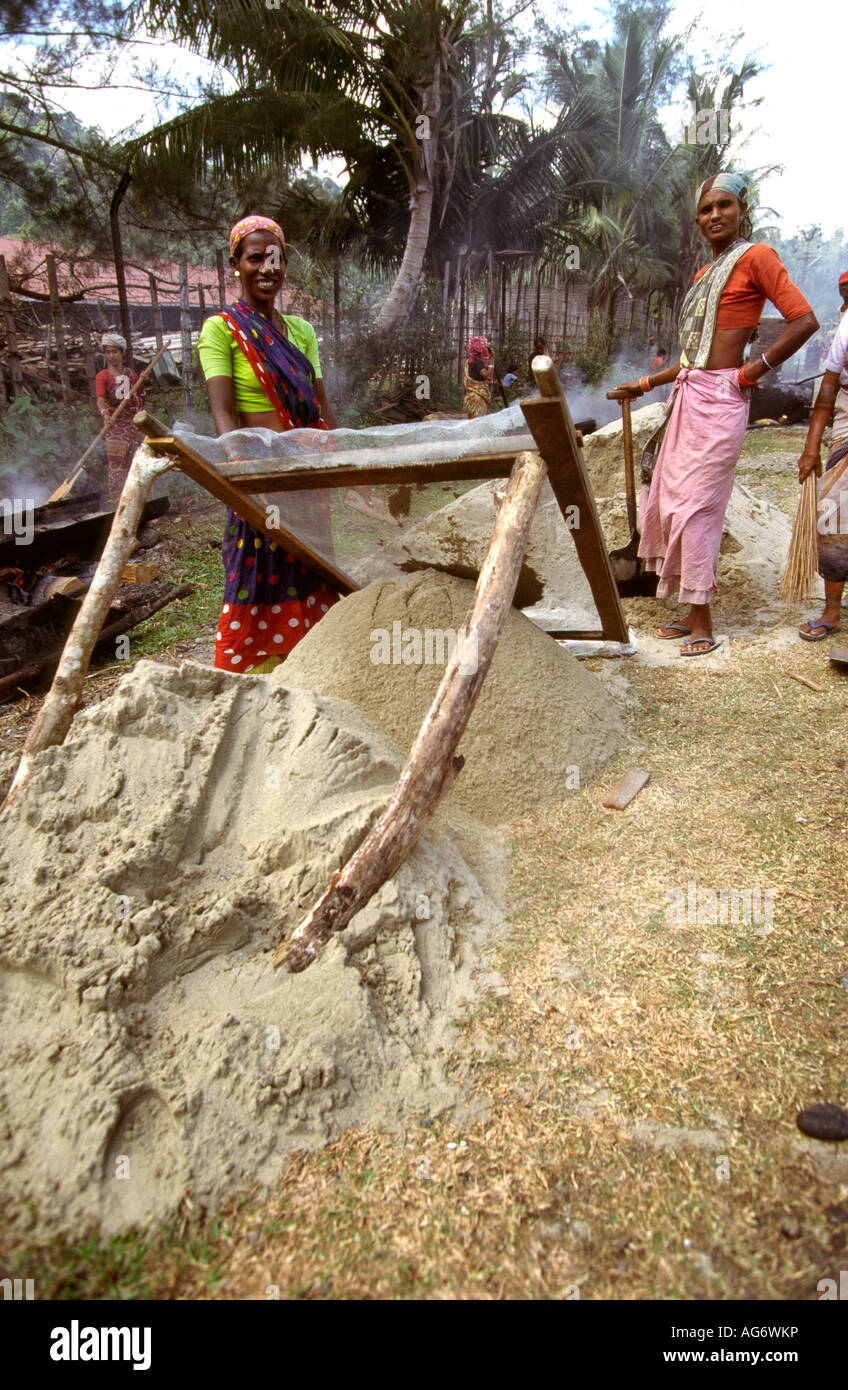 India Middle Andaman Island Betapur women road workers sifting sand ...