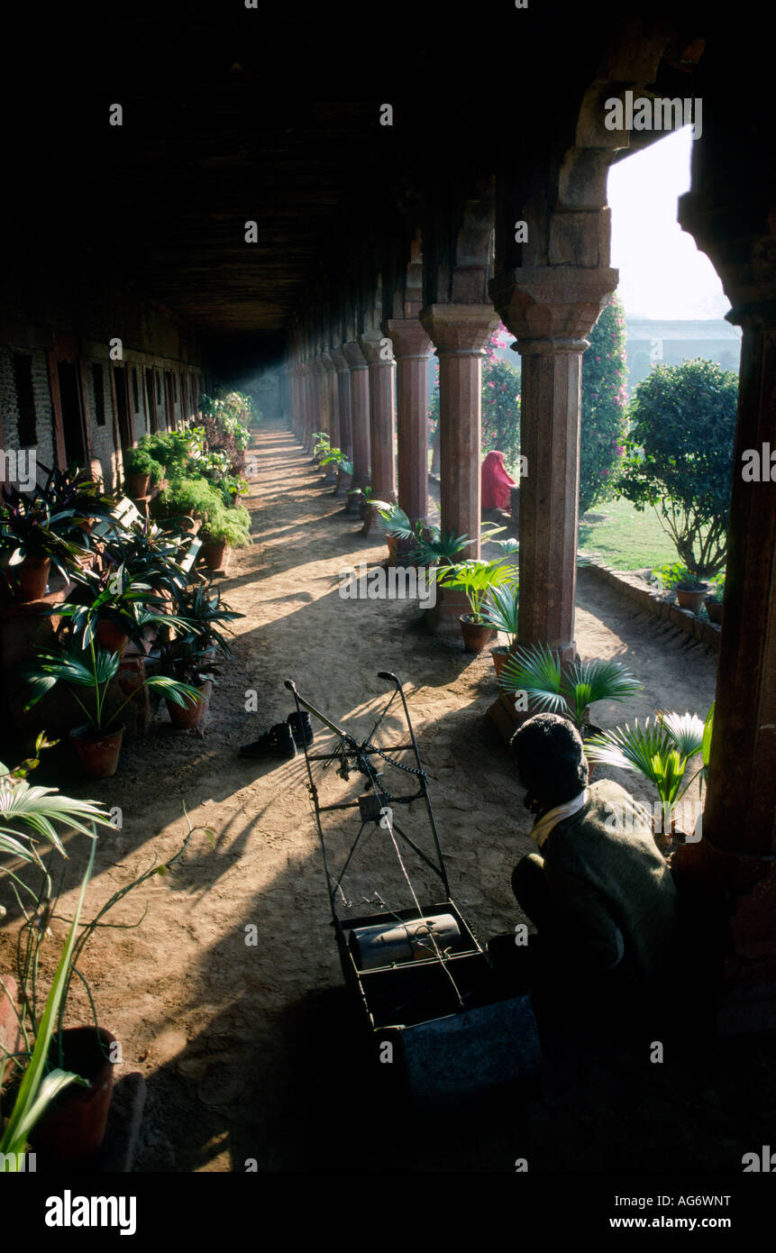 India Uttar Pradesh Agra Taj Mahal garden man maintaining lawn mower ...