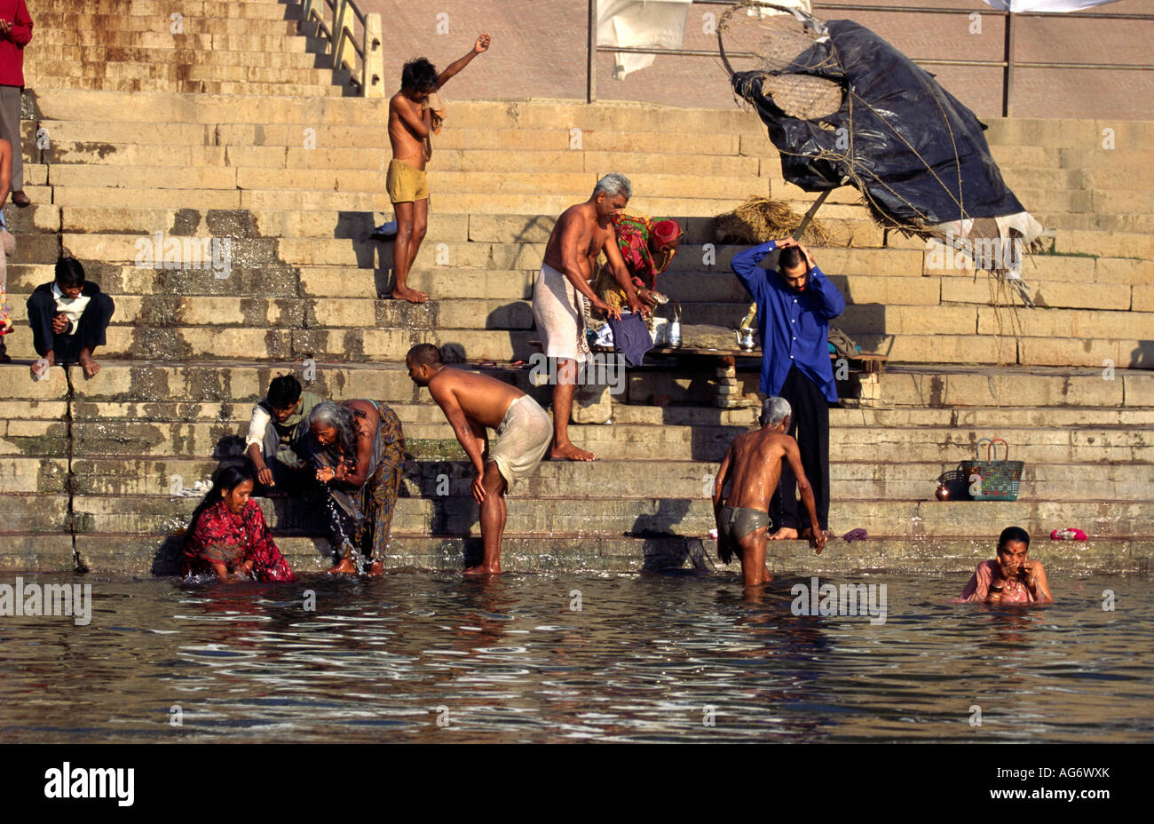 India Uttar Pradesh Varanasi Scindia Ghat pilgrims bathing in River ...