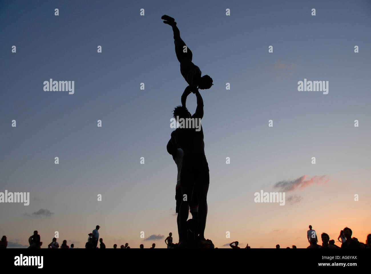 Young African men performing handstand balancing in Banana Beach also ...