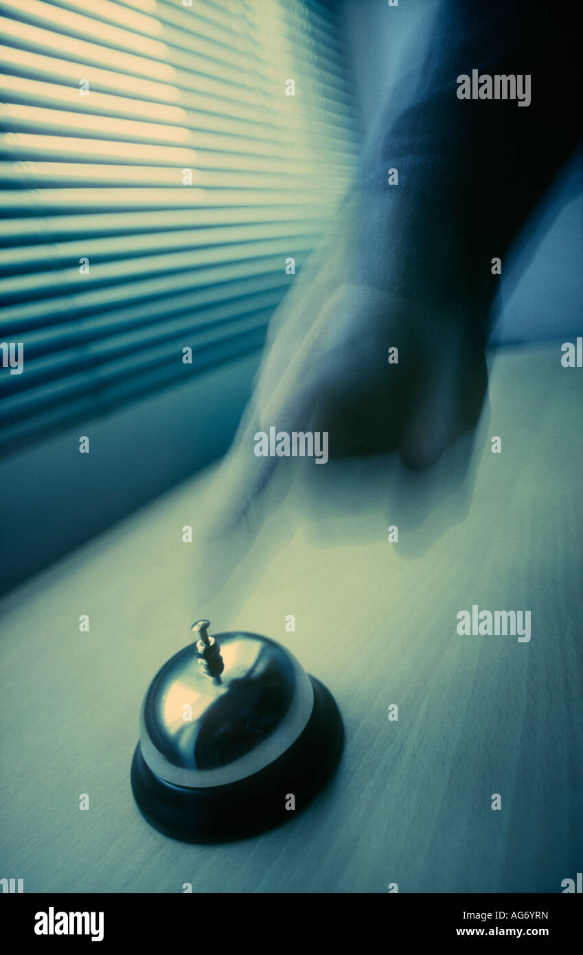 FINGER RINGING DESK BELL Stock Photo - Alamy