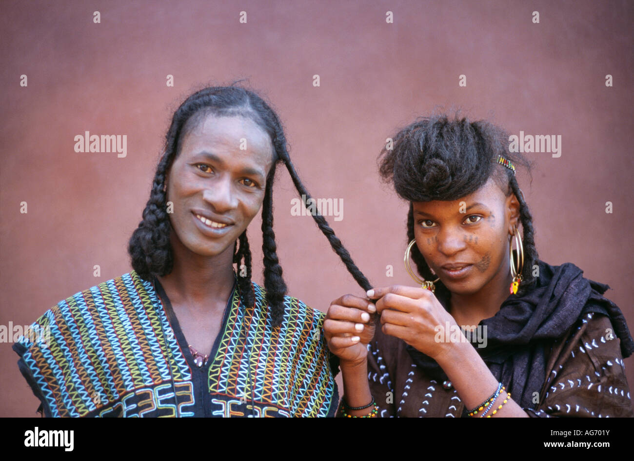 Niger near Agadez Woman making tress in man hair People from Wodaabe ...