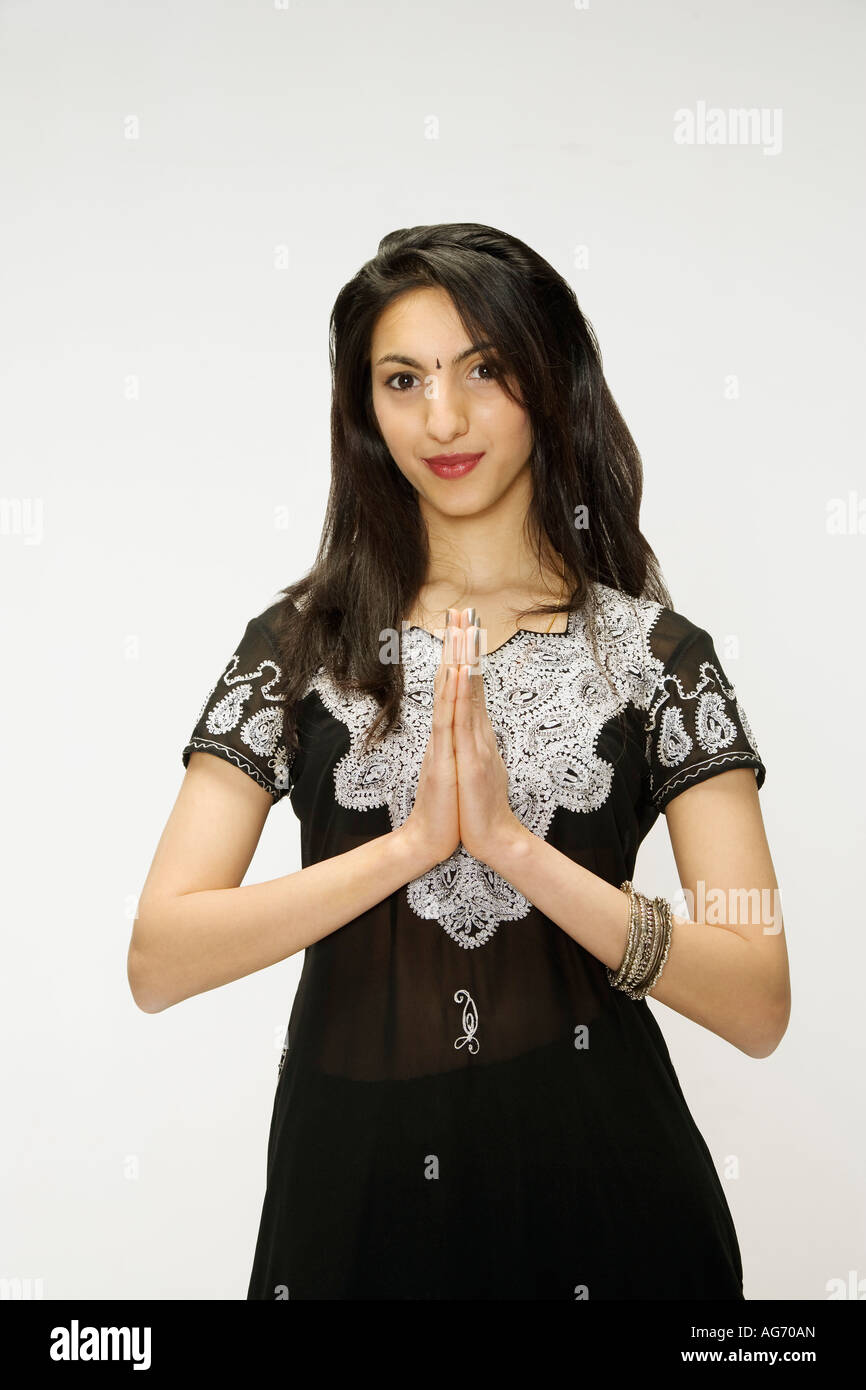 Woman with her hands folded Stock Photo - Alamy