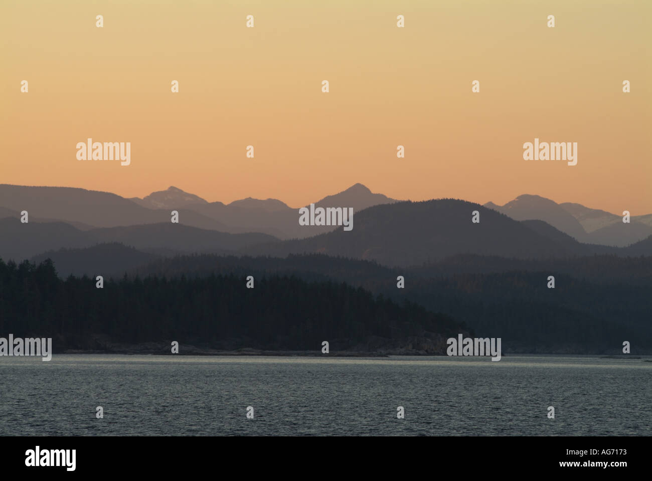 Mainland mountains at dusk Rebecca Spit Provincial Marine Park Quadra ...