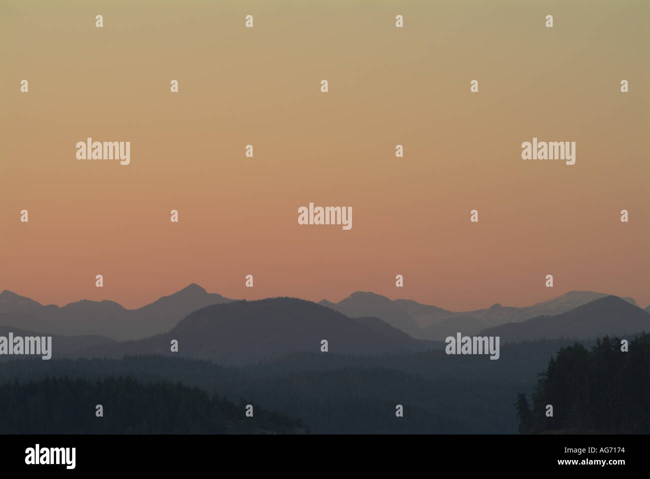 Mainland mountains at dusk Rebecca Spit Provincial Marine Park Quadra ...