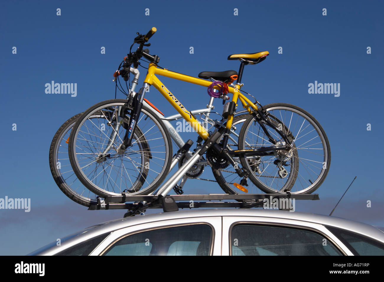 Bicycles on roof rack of car Portugal Stock Photo - Alamy