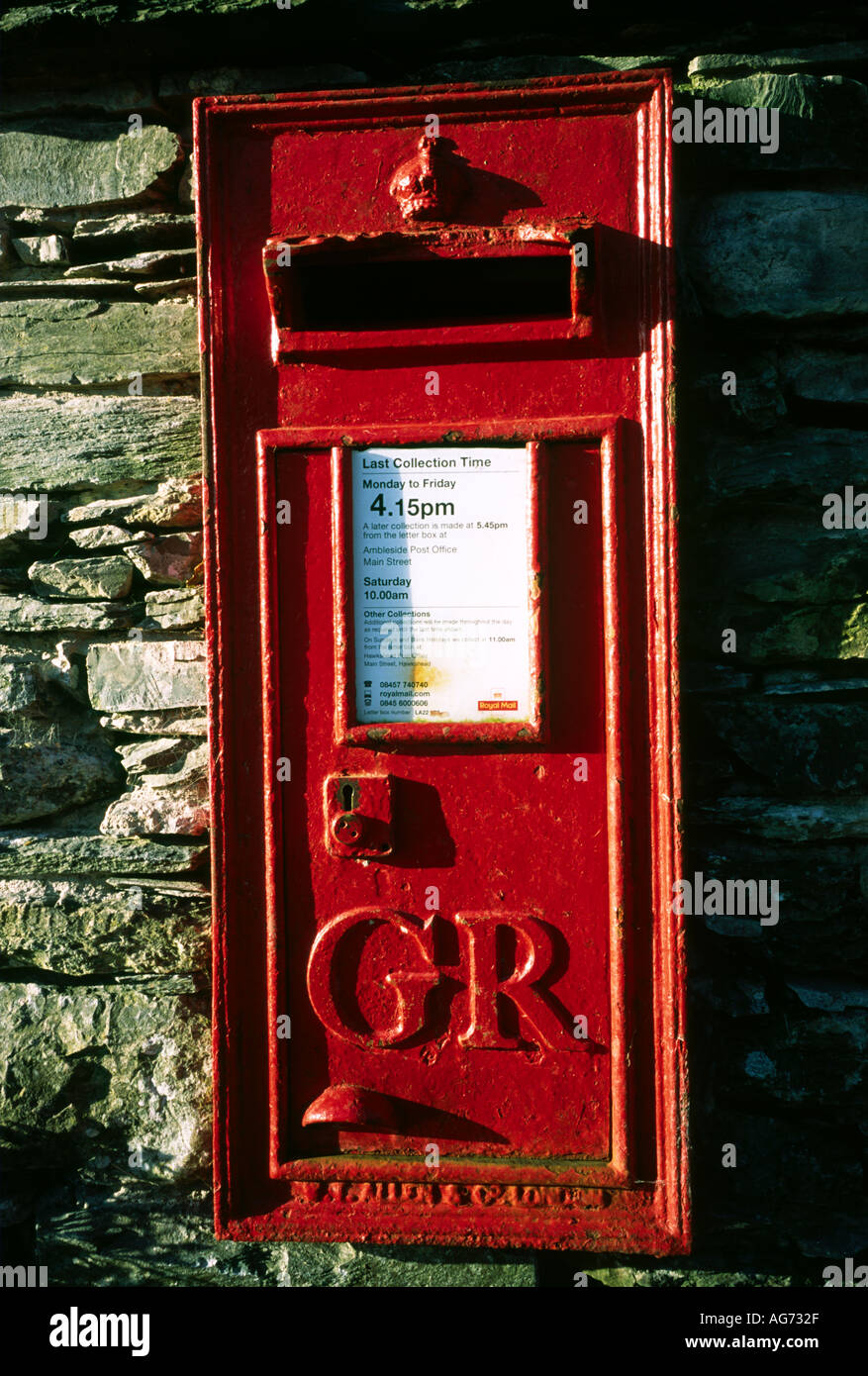 Close up view of letter box mounted in a wall in the village of Sawrey ...