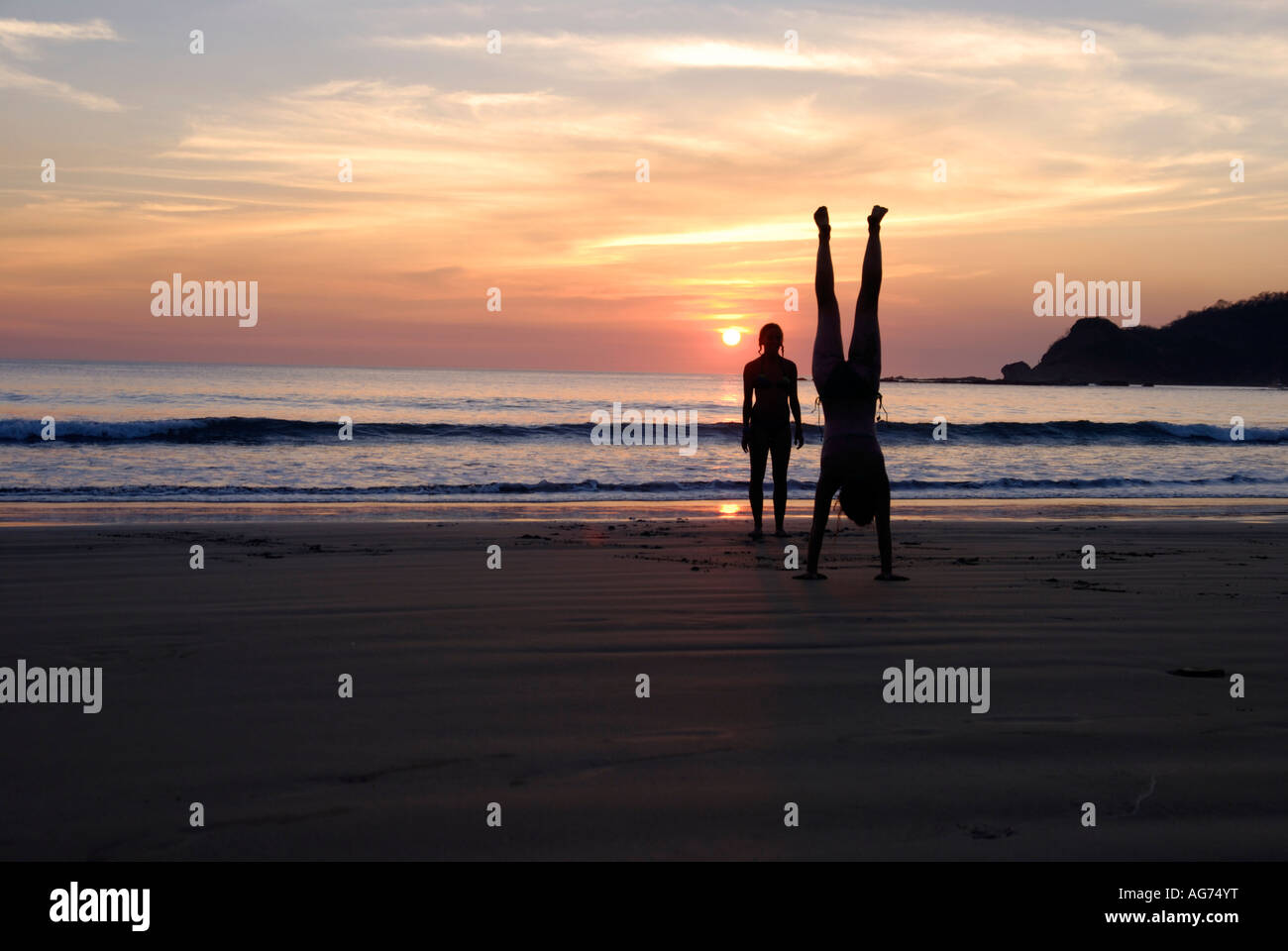 Silhouette girl doing handstand on hi-res stock photography and images ...