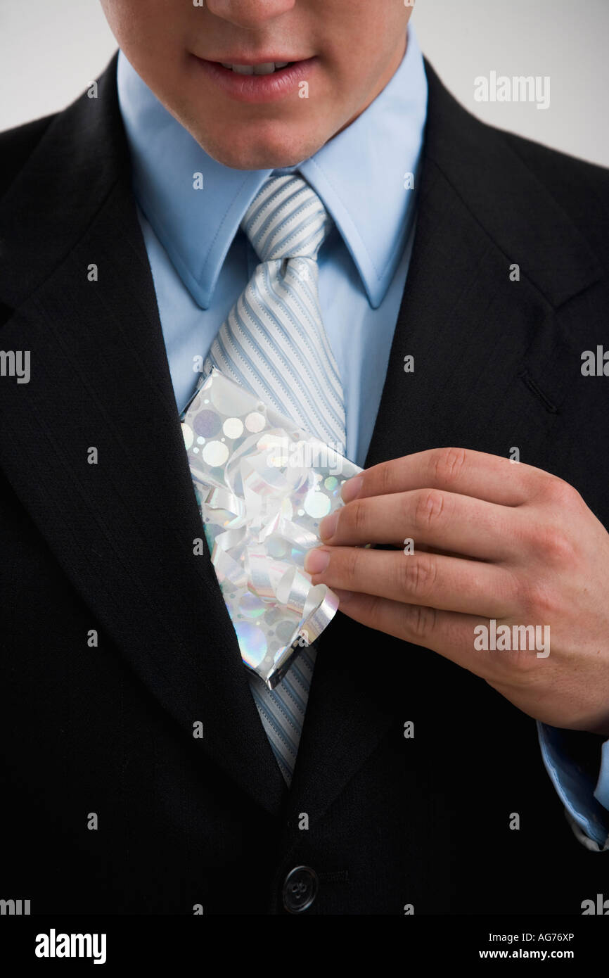 Man hiding gift in his suit Stock Photo - Alamy