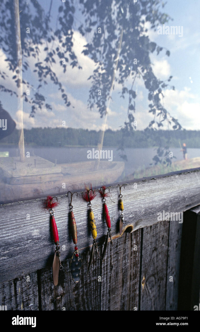 fish hooks at an angler cottage at a lake Stock Photo - Alamy