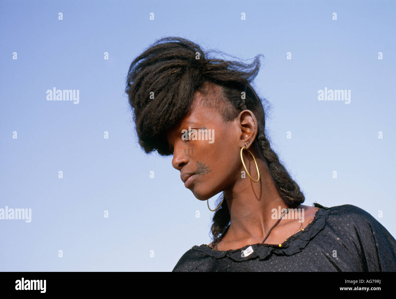 Niger near Agadez Woman of Wodaabe tribe with braided hair wearing ...