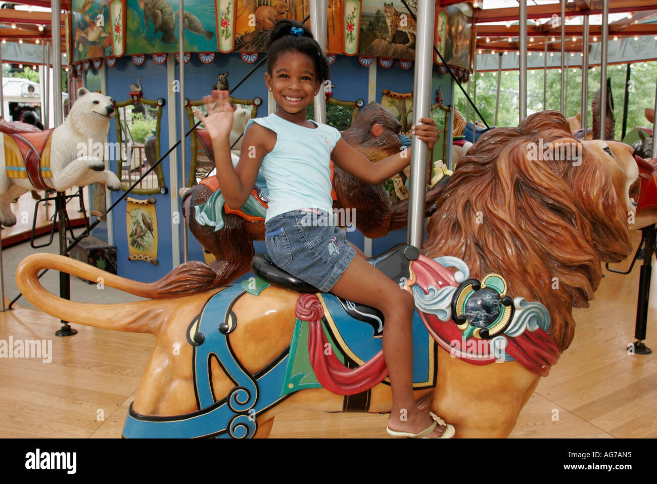 Zoo carousel ride black girl hi-res stock photography and images - Alamy