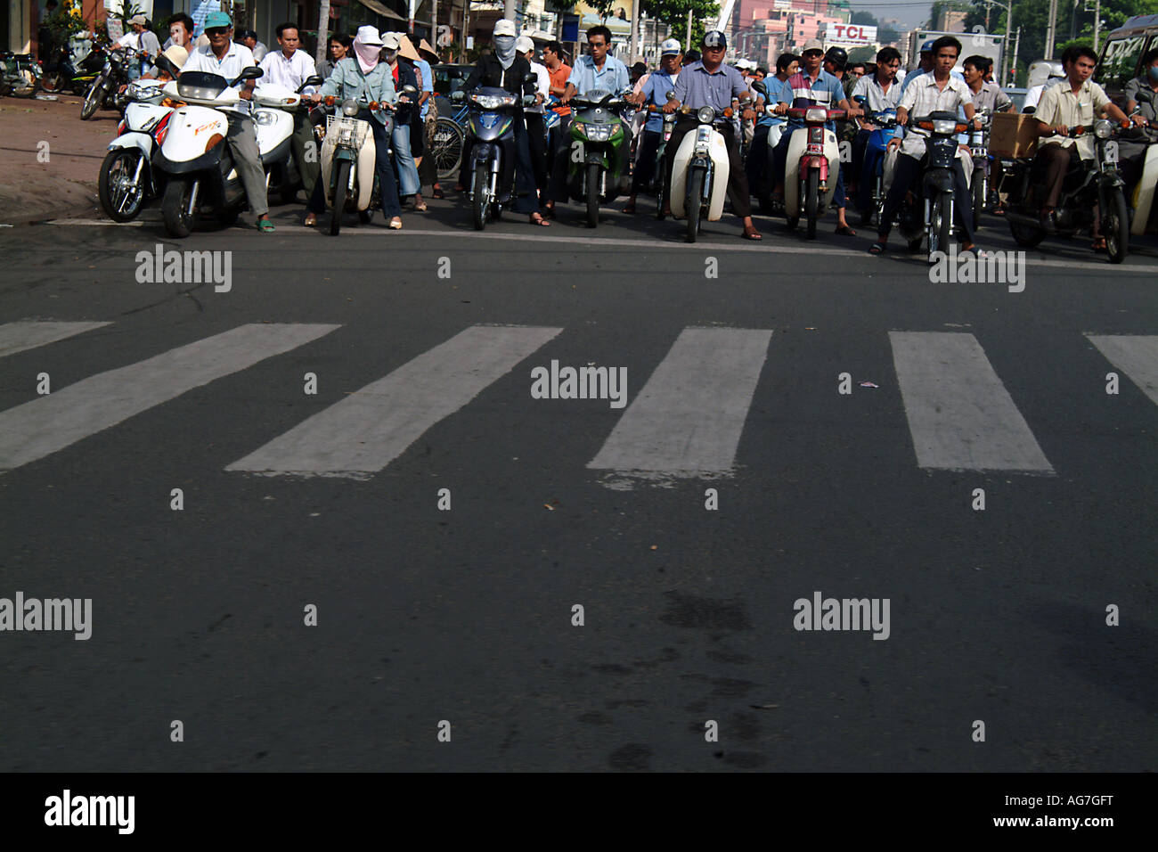 Commuters wait at traffic lights in Ho Chi Min City, Vietnam Stock ...