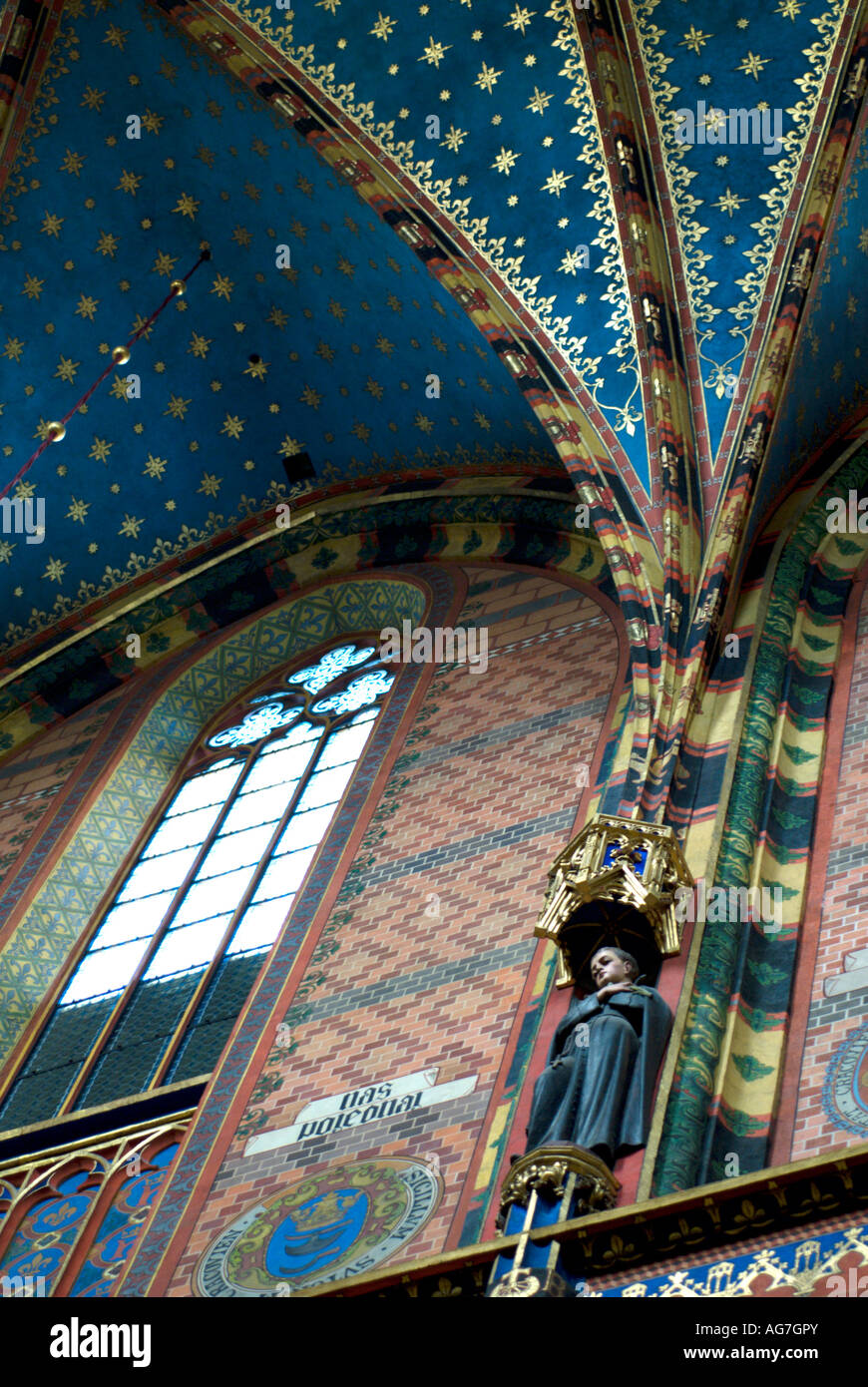 Detail of decorated ceiling arch and painted wall with relief figure ...