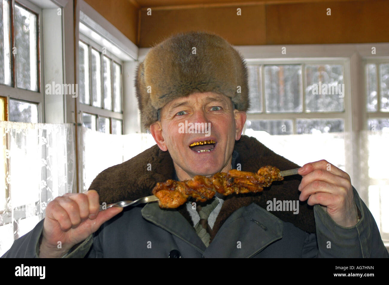 Image of Ivan Petrovic, a 72 yr old Russian with gold teeth eating a ...