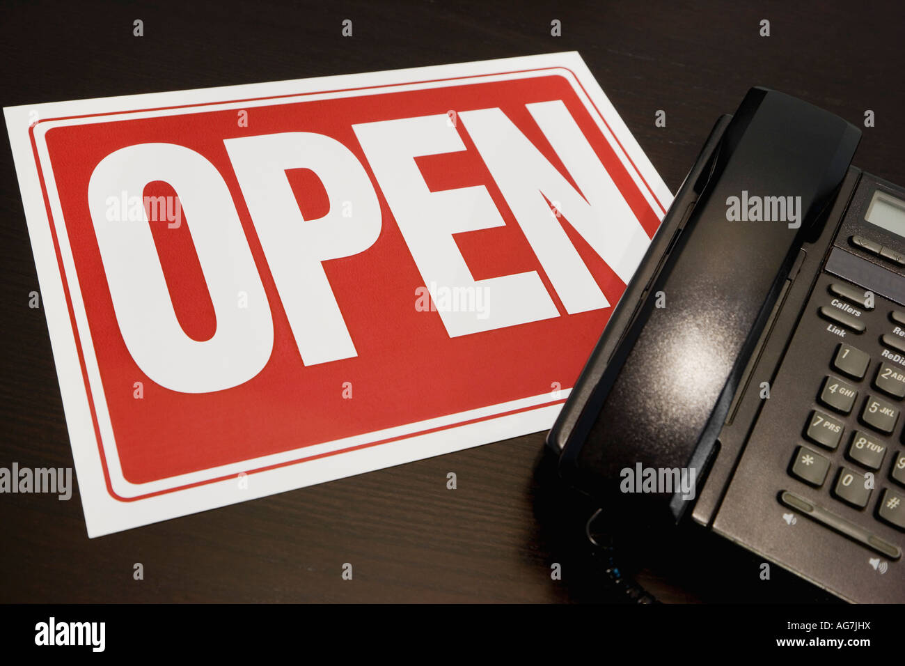 Open sign with a telephone Stock Photo - Alamy