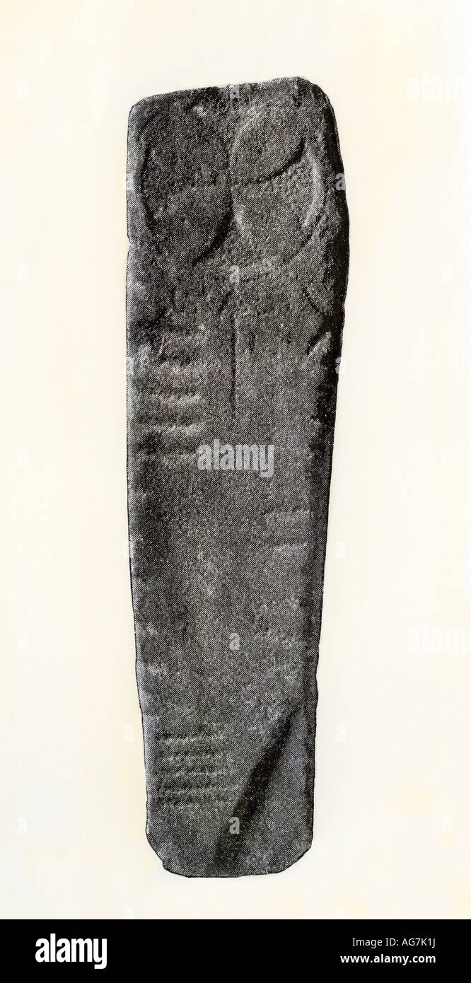 Pagan gravestone carved with sun symbols and Old Irish Ogham cipher ...