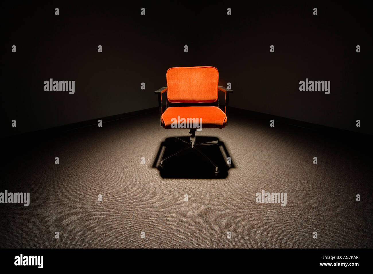Office chair under a spotlight Stock Photo - Alamy