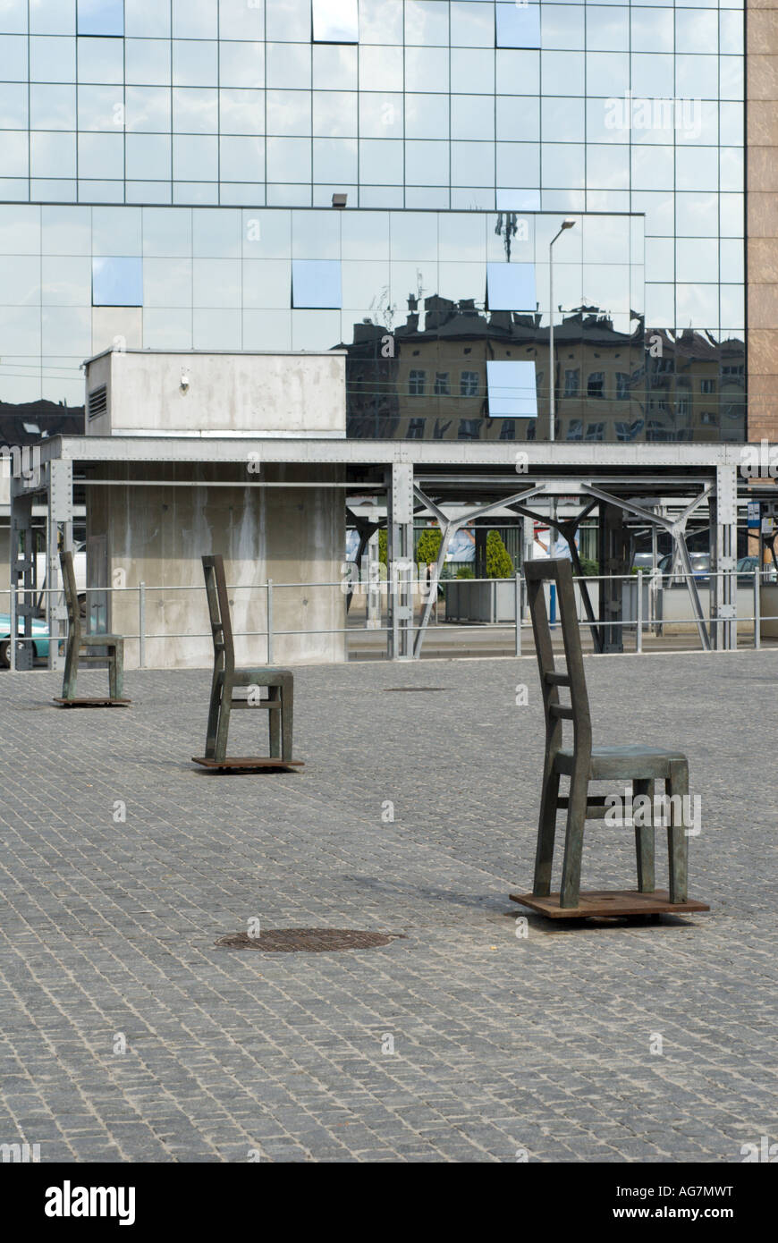 Holocaust memorial sculptures of empty chairs in square in Podgorze ...