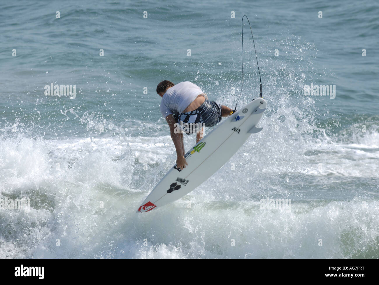 Pro surfer Dane Reynolds performing an aerial maneuver on waves in ...
