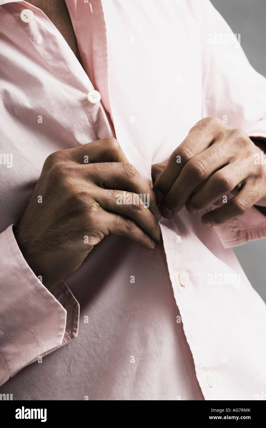 Unbuttoning shirt hi-res stock photography and images - Alamy