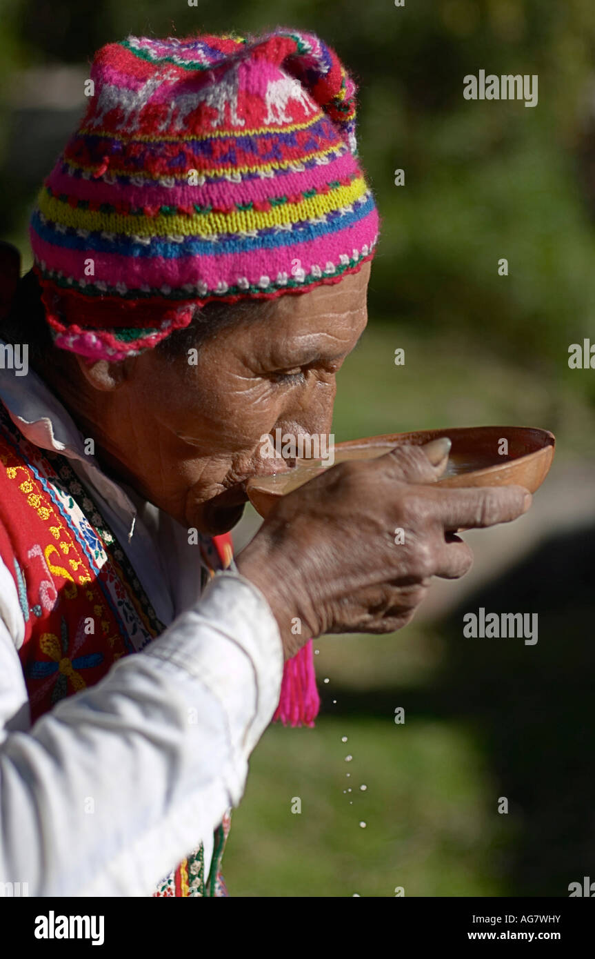 Quechuan man drinking homemade chicha a type of corn beer Cuchuma Peru ...
