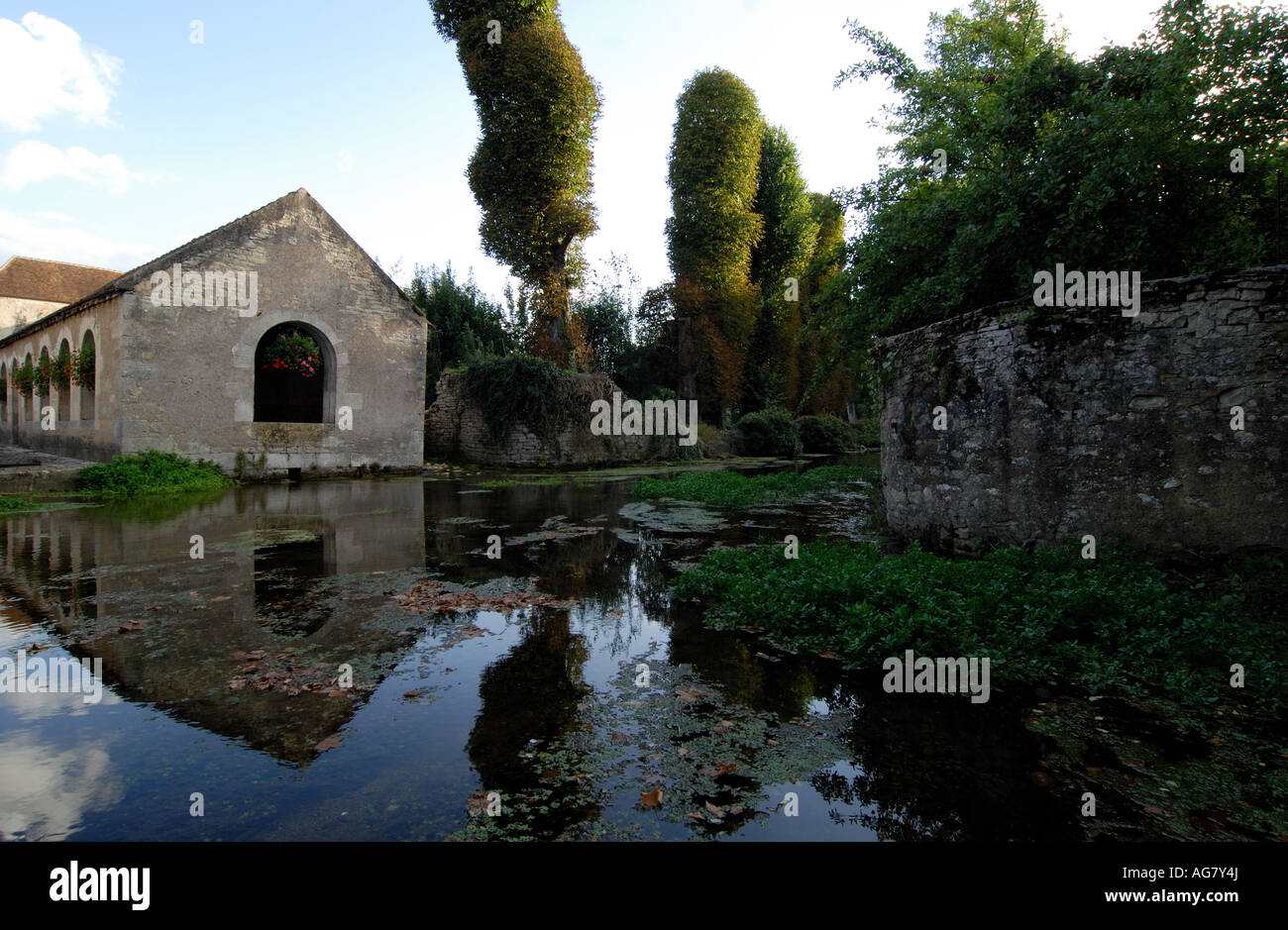 Medieval laundry house by stream in town of Noyers-sur-Serein, Burgundy ...